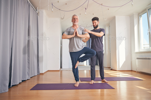 Man standing on one foot during the balance exercise Stock Photo by ...