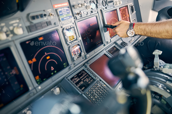Flight deck of the modern passenger plane Stock Photo by svitlanah