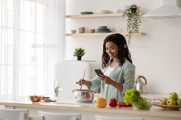 Chef enjoy food taste indoors. Modern mobile app for recipes Stock ...