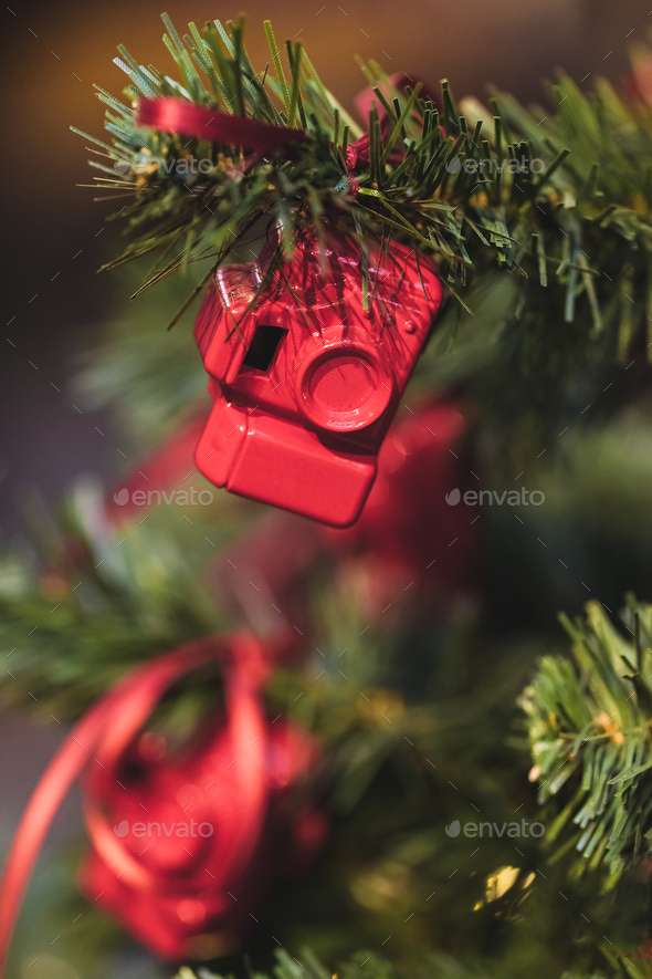 Christmas tree decorated with small figures of red photo cameras Stock ...