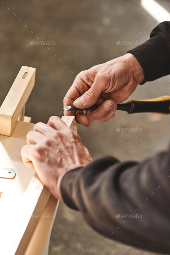 Custom woodworking and carpentry. Close up of a carpenter's hands ...