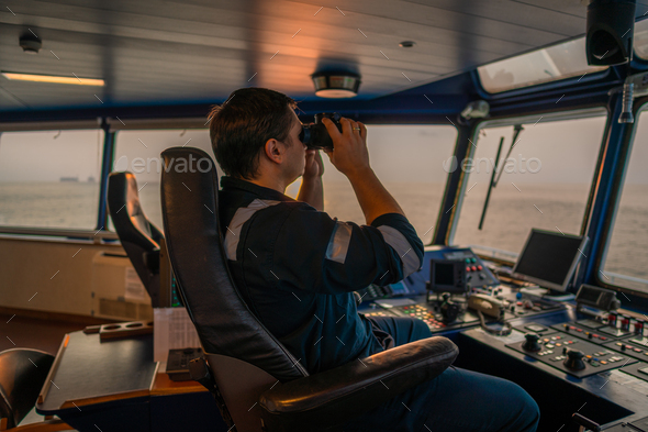 Marine navigational officer during navigational watch on Bridge Stock ...