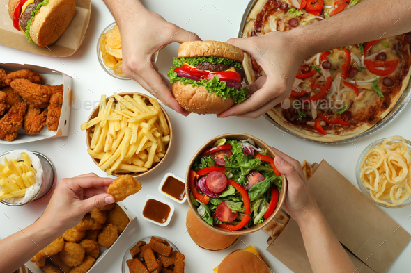 Concept of fast food on white background Stock Photo by AtlasComposer