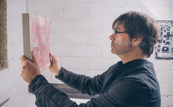 Painter artist looking his finished modern artwork Stock Photo by ...