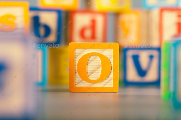 Photograph of colorful Wooden Block Letter O Stock Photo by FabrikaPhoto