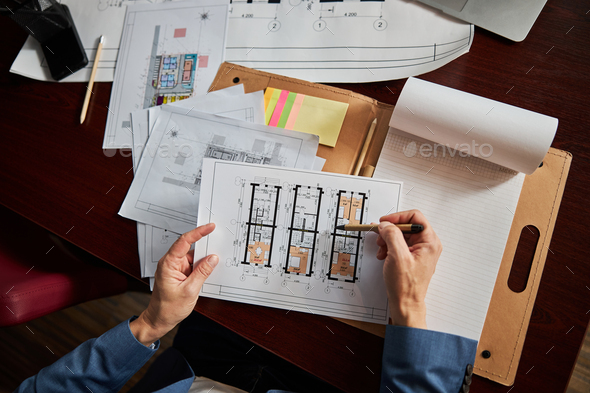 Office worker checking important documents at the desk Stock Photo by ...