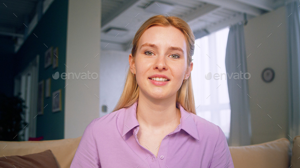Smiling girl talking to camera making conference video call Stock Photo ...