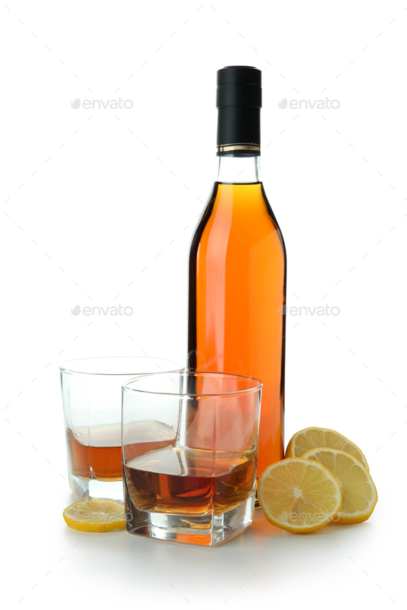 Concept of hard alcoholic drinks with cognac, isolated on white ...