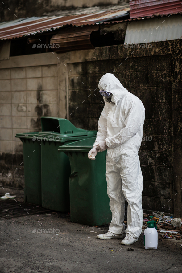 Man in personal protective equipment ppe suit wearing clear glasses and ...