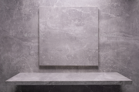 Abstract grey background texture and shelf at wall. Picture frame at ...