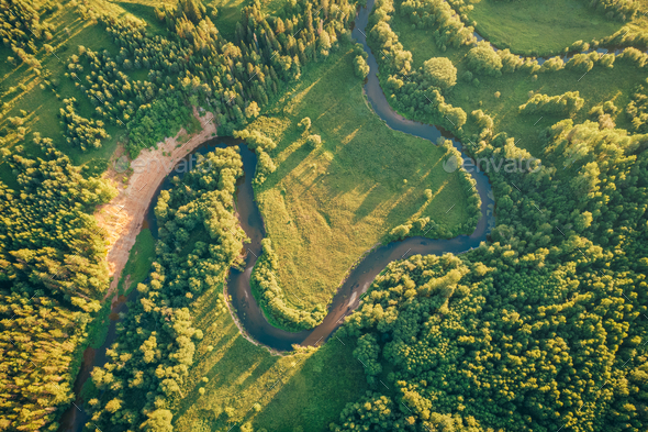 Fields and small narrow winding river aerial view Stock Photo by Fasci