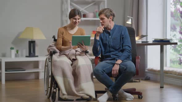 Positive Disabled Girlfriend in Wheelchair Talking with Smiling ...