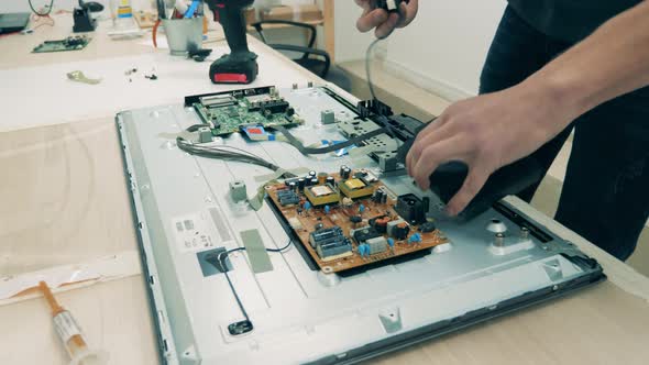 Male Engineer Is Dismantling an Electronic Device, Stock Footage ...