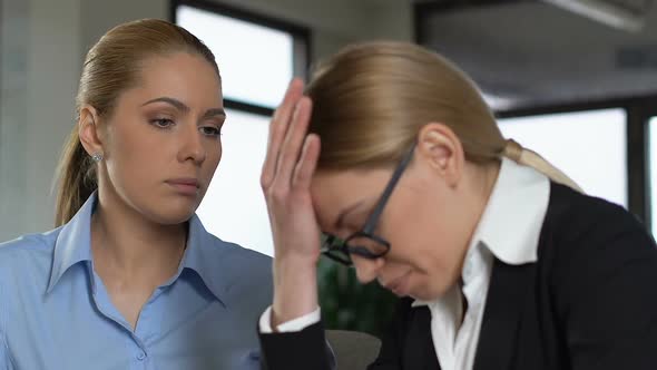 Female Employee Comforting Upset Colleague, Supporting Friend, Work ...