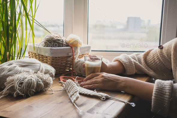 Knitting from threads at home. Hobby, relaxation, meditation, mental ...