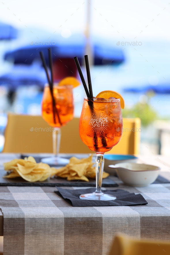 aperitif with aperol crisps on a table Stock Photo by CCpreset | PhotoDune