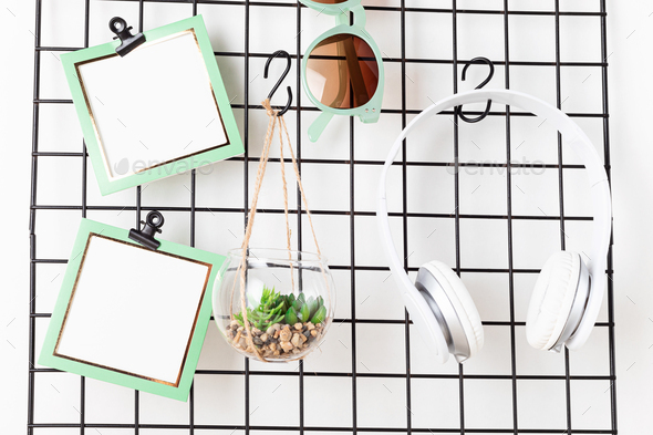 Mockup of mesh board with cards, eyeglasses, house plants Stock Photo ...