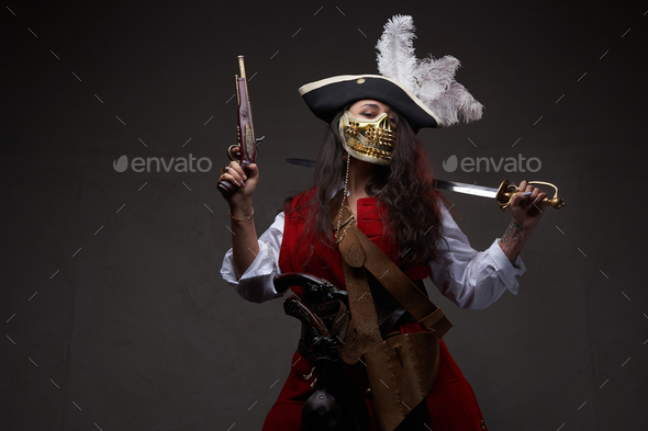 Caribbean female dangerous bandit wearing golden mask Stock Photo by ...