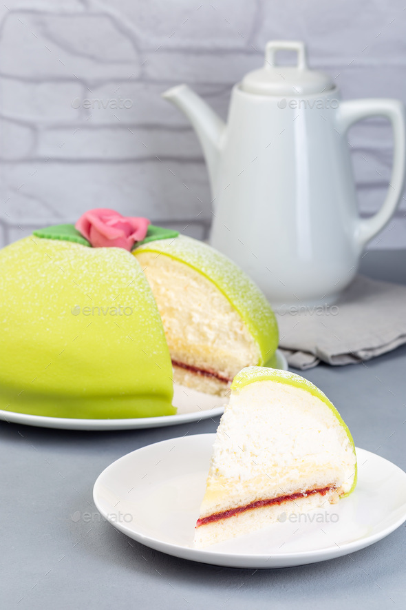 Traditional Swedish dessert Princess cake with green marzipan cover and ...