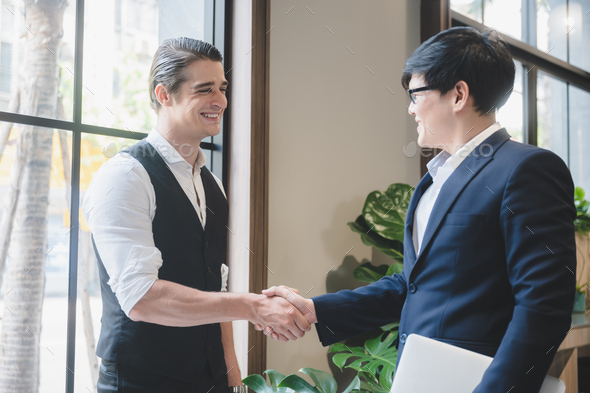 businessperson partner team, brainstorming and handshake cooperation ...