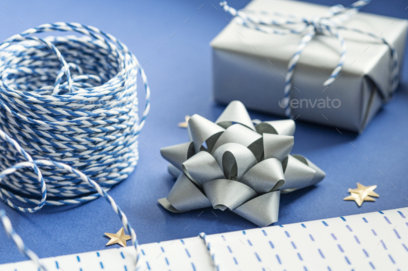 Gift packaging: silver bows for gift decoration, blue gift rope, gift ...
