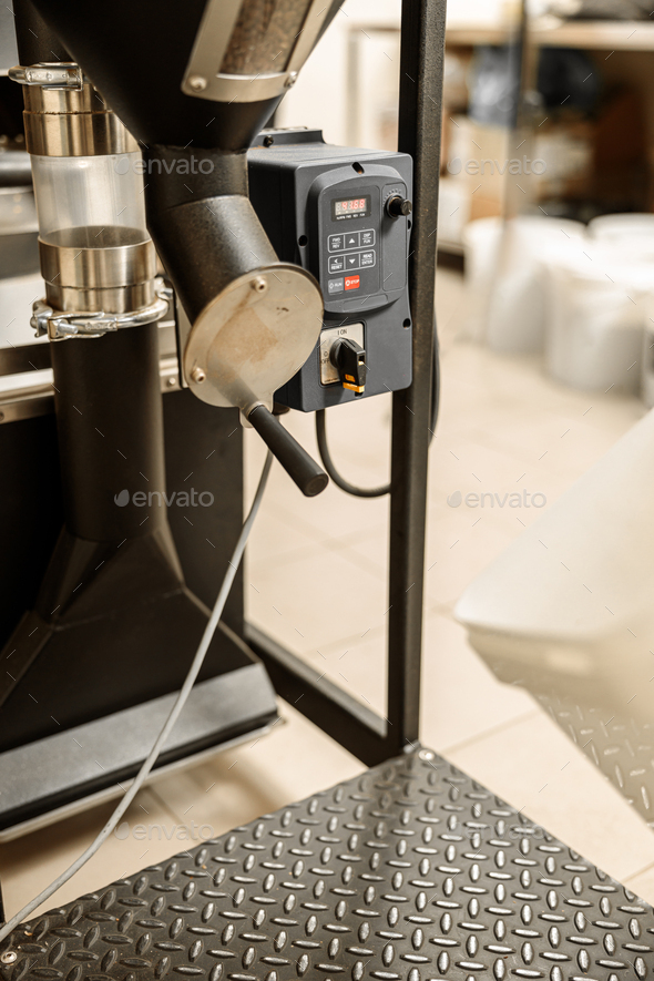 Coffee processing. Roastery, roasting machine and fresh beans Stock ...