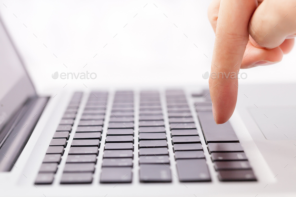 Human hands going to press a button on keypad in white isolated ...