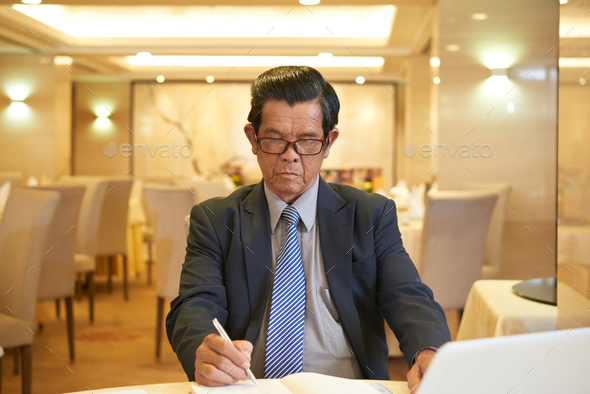 Restaurant Owner Signing Documents Stock Photo by DragonImages | PhotoDune
