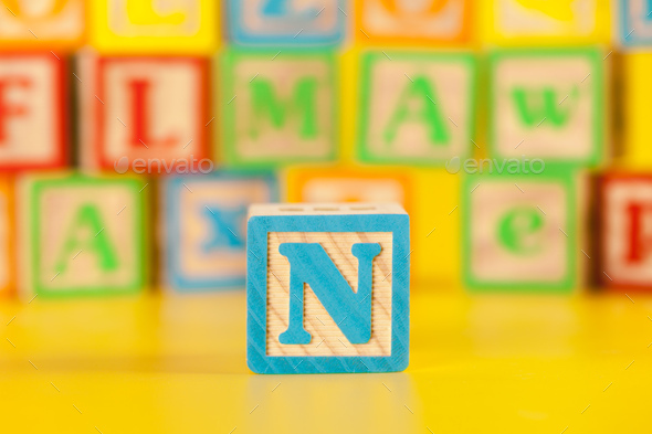 Photograph of colorful Wooden Block Letter N Stock Photo by FabrikaPhoto