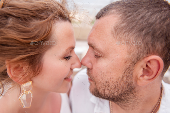 A very close-up portrait of a couple in love who looks at each other ...