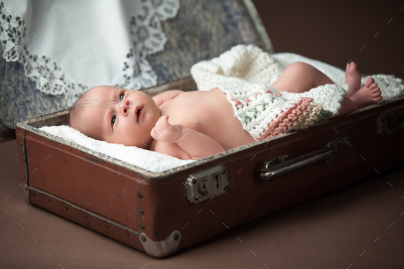 Cute baby laying in suitcase Stock Photo by YouraPechkin | PhotoDune