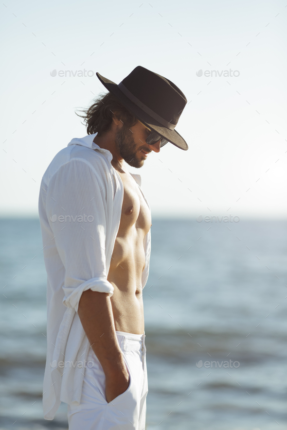 Man on a Beach Summer Holiday Vacation Concept Stock Photo by artfotodima