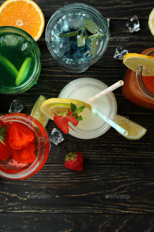 Fresh summer cocktails on rustic wooden table Stock Photo by AtlasComposer