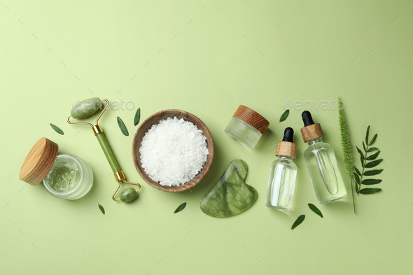 Skin care beauty concept with face roller on green background Stock ...