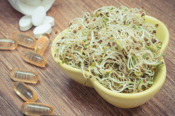 Sprouts as source vitamins and tablets supplements. Choice between ...
