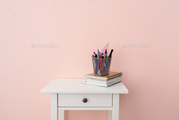 School supplies on bedside table Stock Photo by molenira | PhotoDune