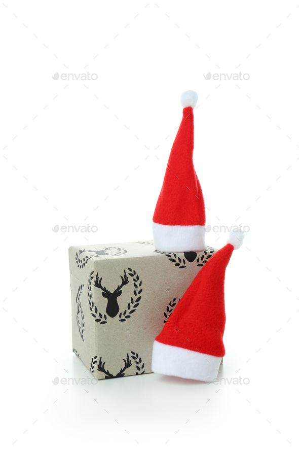 Christmas boxes and Santa hats isolated on white background Stock Photo ...