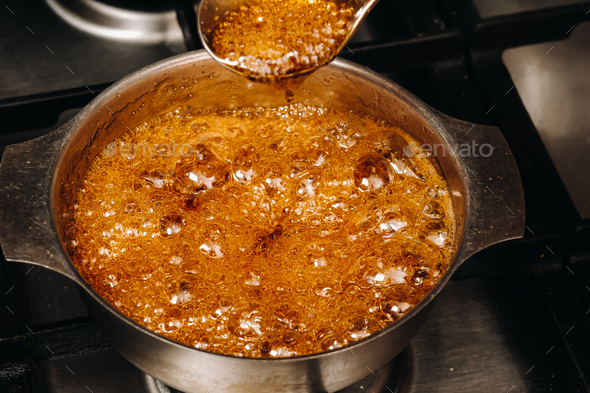 Preparation of sugar candies at home.A taste of our childhood.Rooster ...