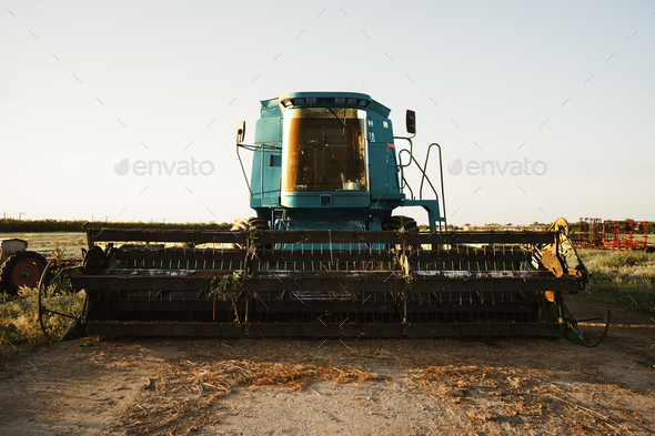 Blue combine harvester agriculture machine harvesting in a field Stock ...