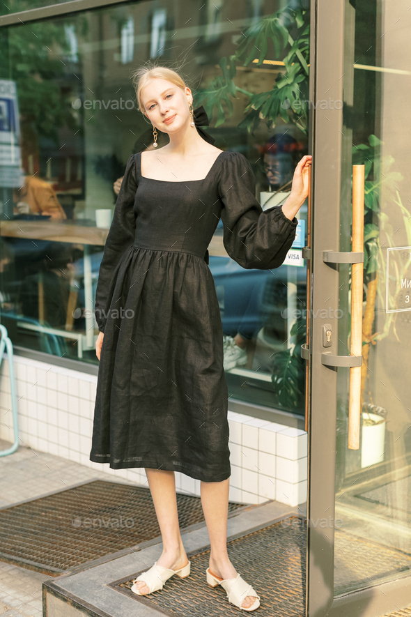 Street style fashion. Girl model in a multiply linen dresses. Pretty ...