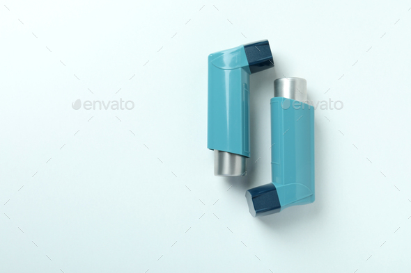 Blue asthma inhalers on white background, top view Stock Photo by ...