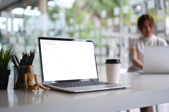 Close up view computer laptop with blank screen on white office desk ...