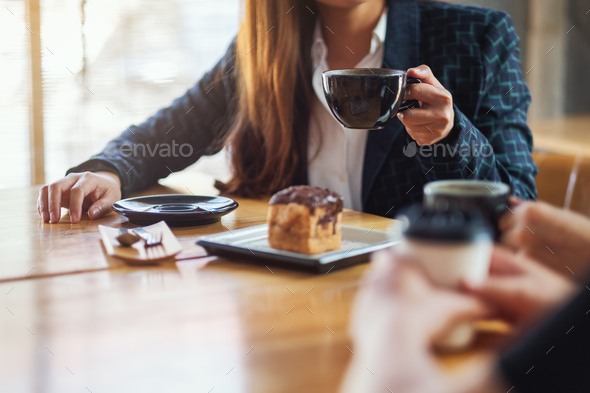 Closeup image of people enjoyed talking, eating and drinking coffee ...