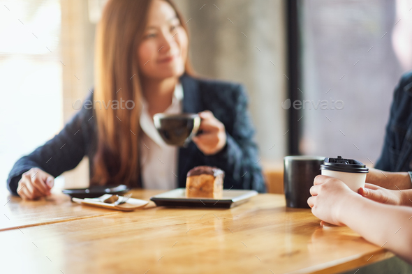 Closeup image of people enjoyed talking, eating and drinking coffee ...