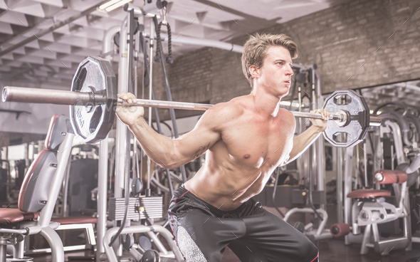 Bodybuilder training hard in the gym Stock Photo by oneinchpunchphotos