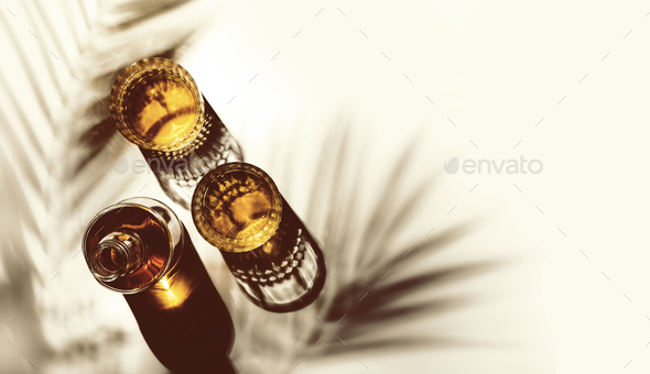 American bourbon whiskey in glasses and bottle, white background with ...