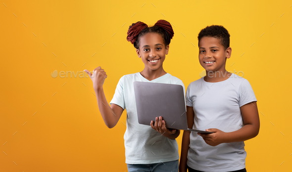 Happy black kids enjoying their new laptop, panorama Stock Photo by ...
