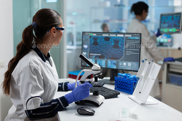Biologist researcher doctor doing chemistry experiment using medical ...
