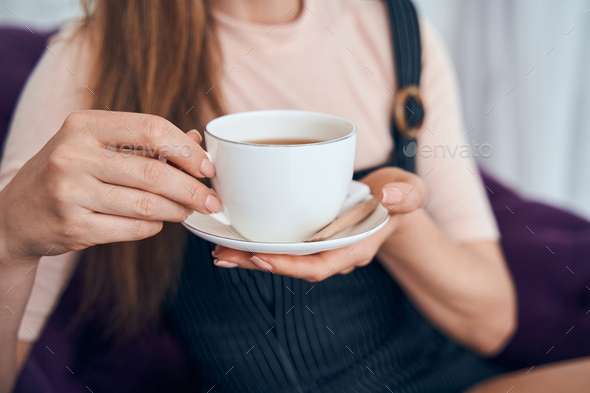 Close up of female hand holding cup Stock Photo by Iakobchuk | PhotoDune