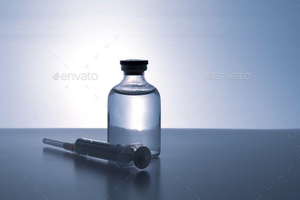 Bottle with solution for injection and injection needle Stock Photo by ...